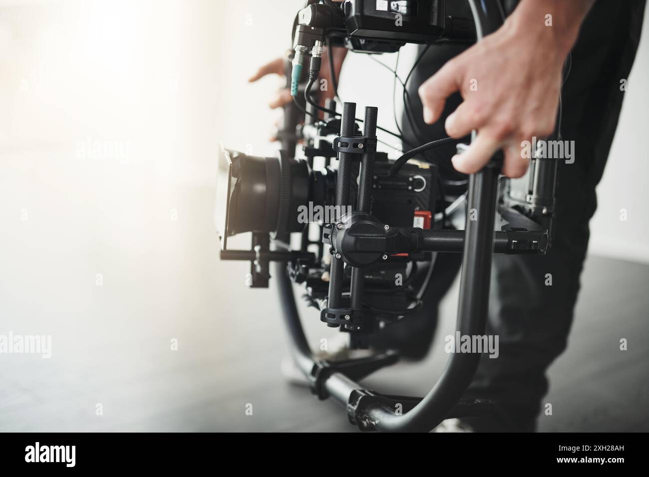 Studio, camera and hands of videographer filming for photography ...