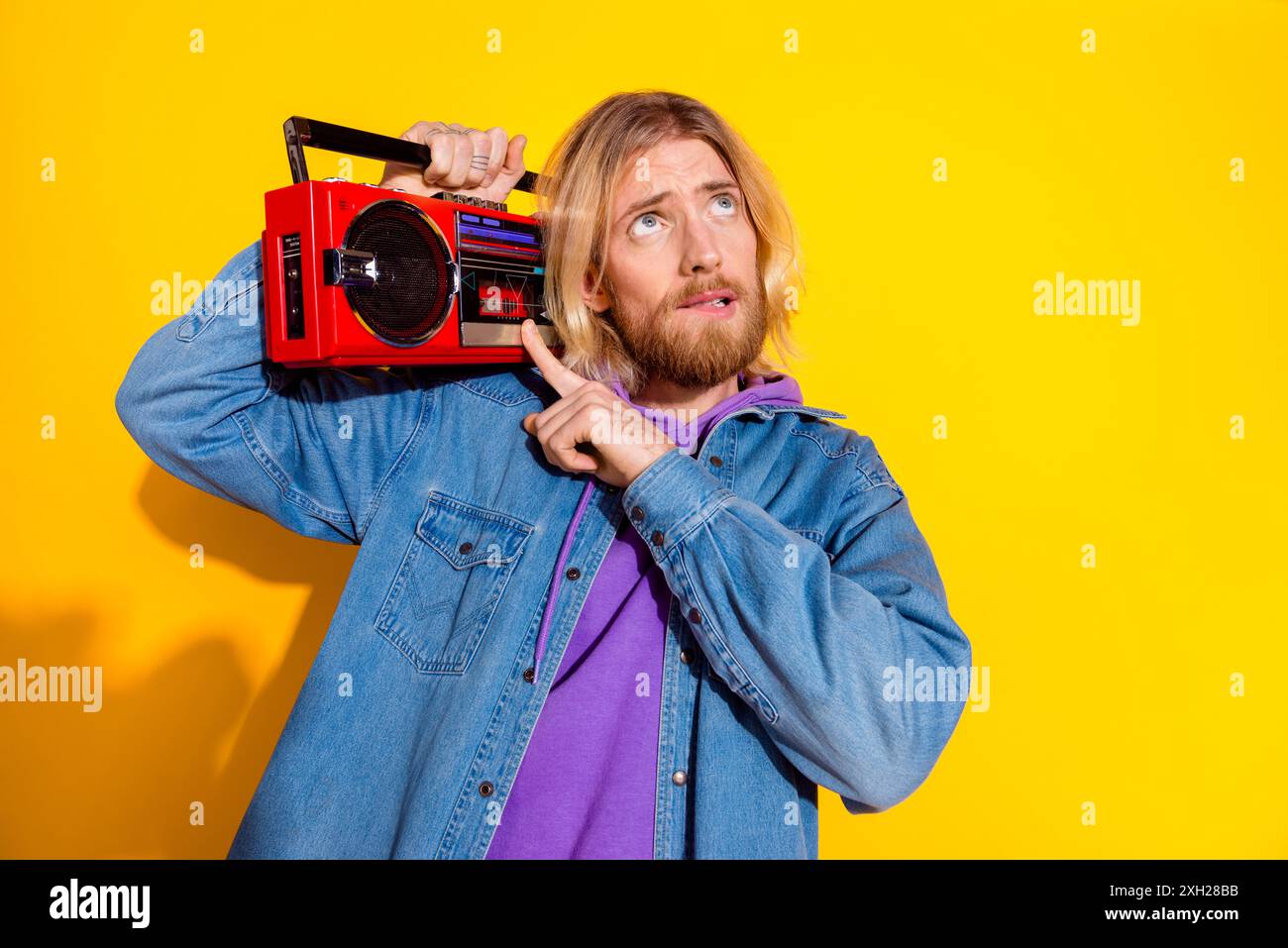 Full size photo of nice young man press play button boombox wear denim ...