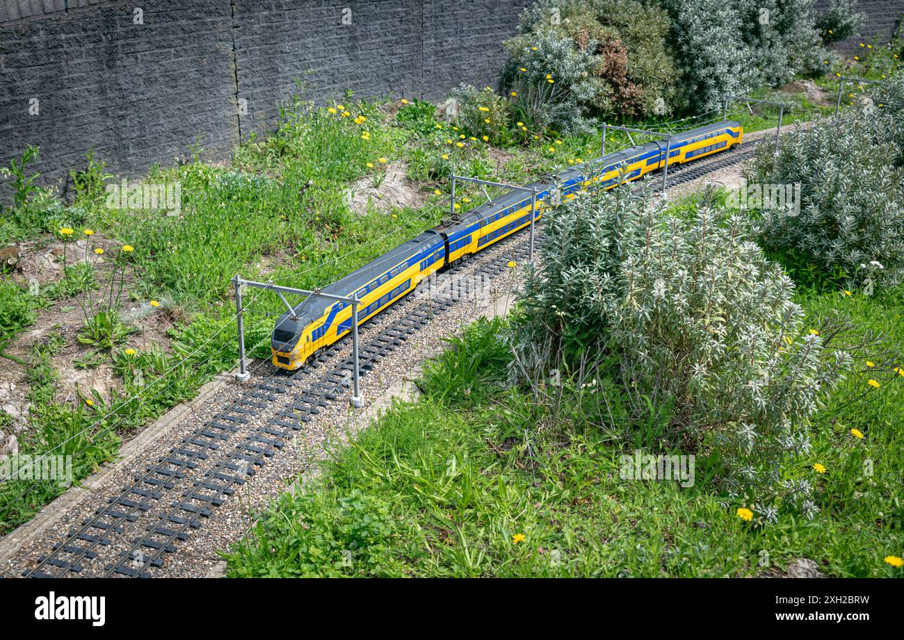 yellow toy train scale 1 on 25 in the netherlands Stock Photo - Alamy
