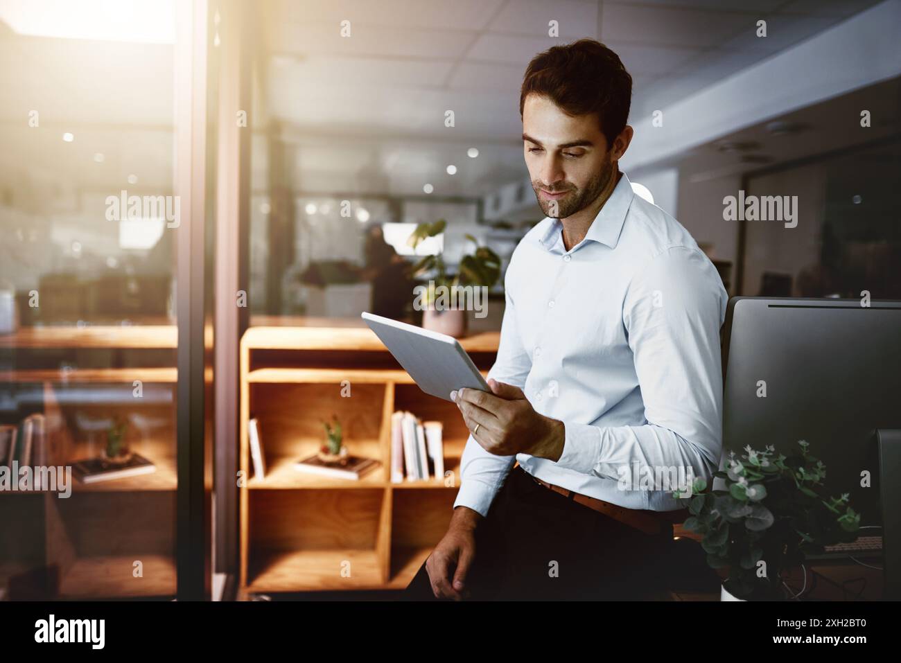 Businessman, tablet and night with office, research and overtime work ...