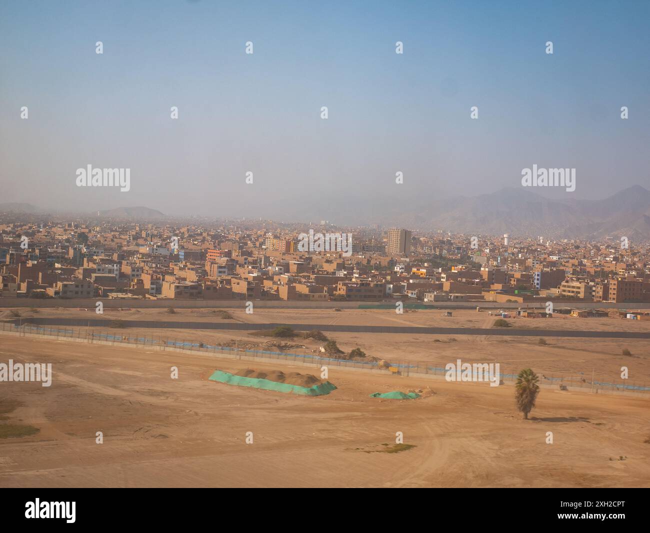 View of the City, Dry and Yellow Ground with a Cloudy and Polluted Sky ...