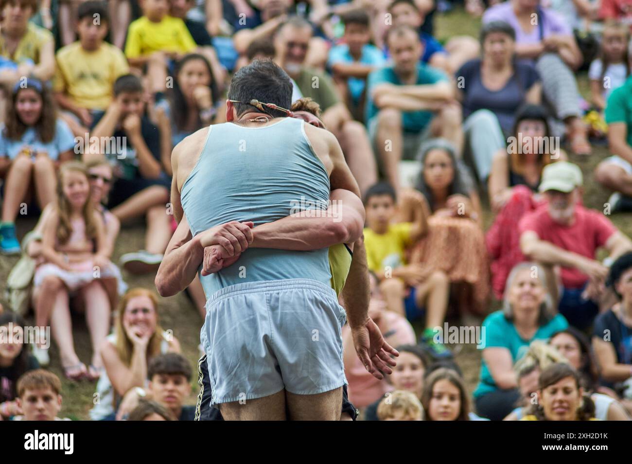 Viladecasn, SPAIN - JULY 11, 2024: Two athletes share a hug in a moment ...