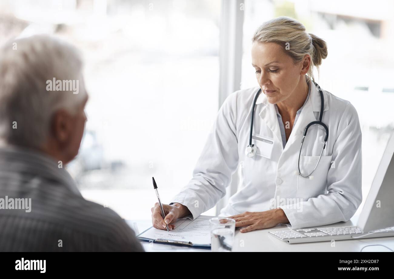 Writing, doctor and senior patient in medical consultation for ...