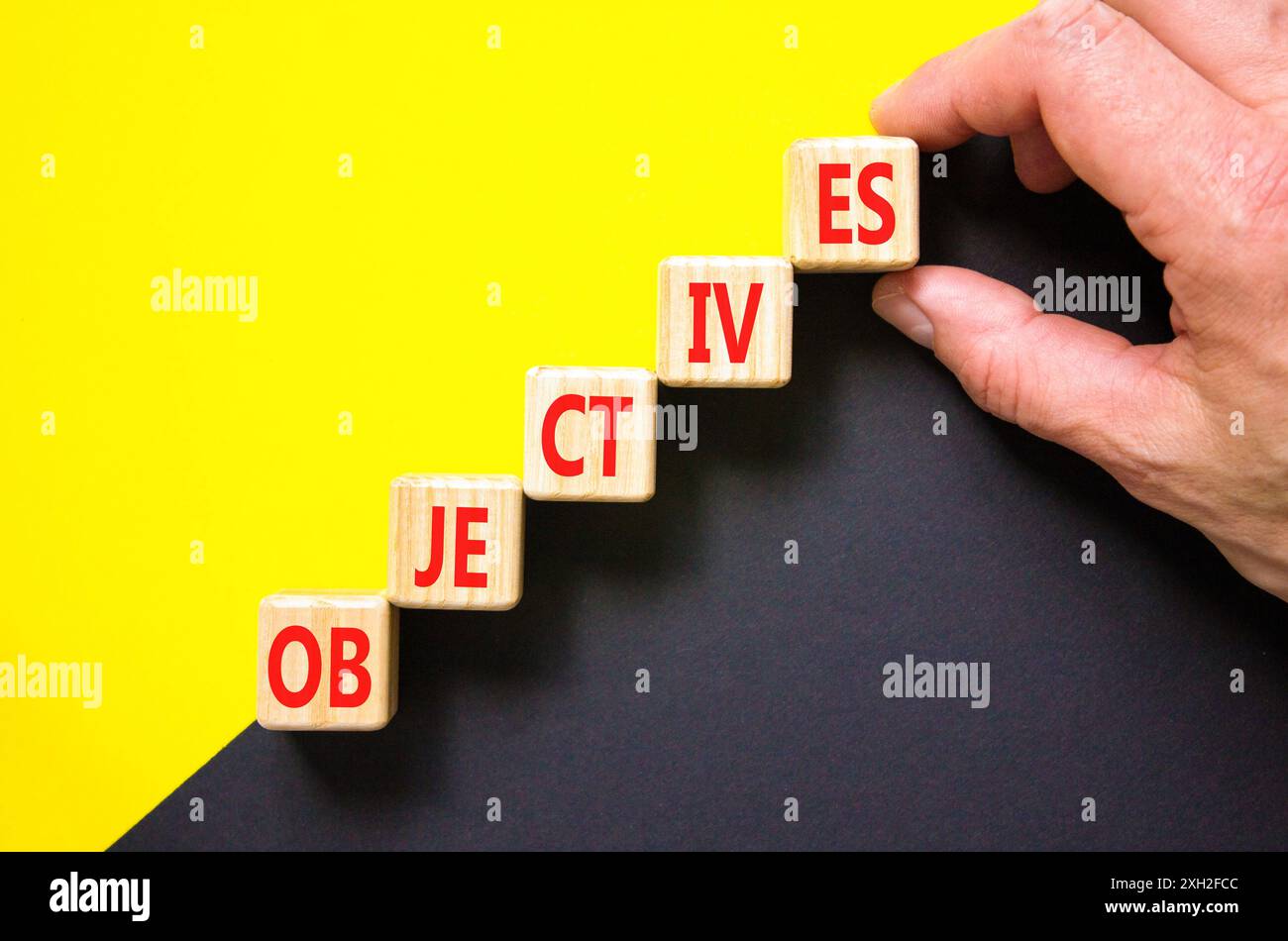 Objectives symbol. Concept word Objectives on beautiful wooden cubes ...