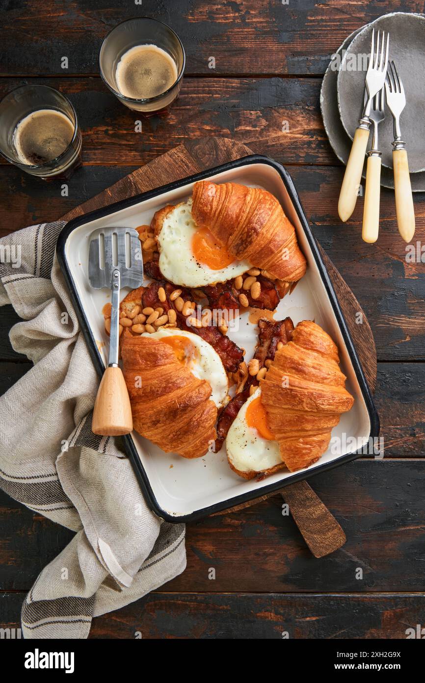 Croissants English breakfast. Delicious fresh breakfast grilled three ...
