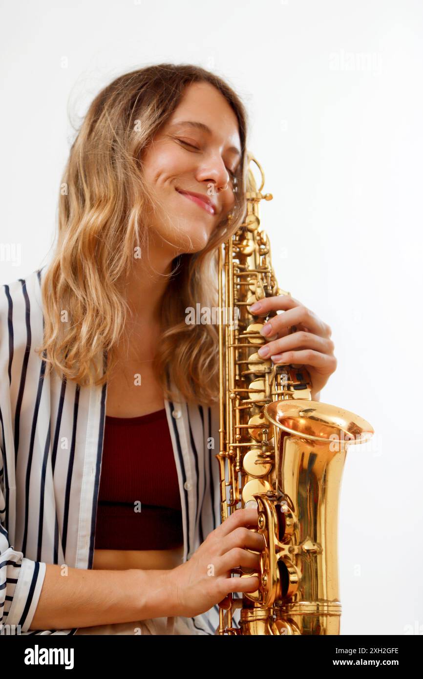 Woman playing saxophone saxophone hi-res stock photography and images ...