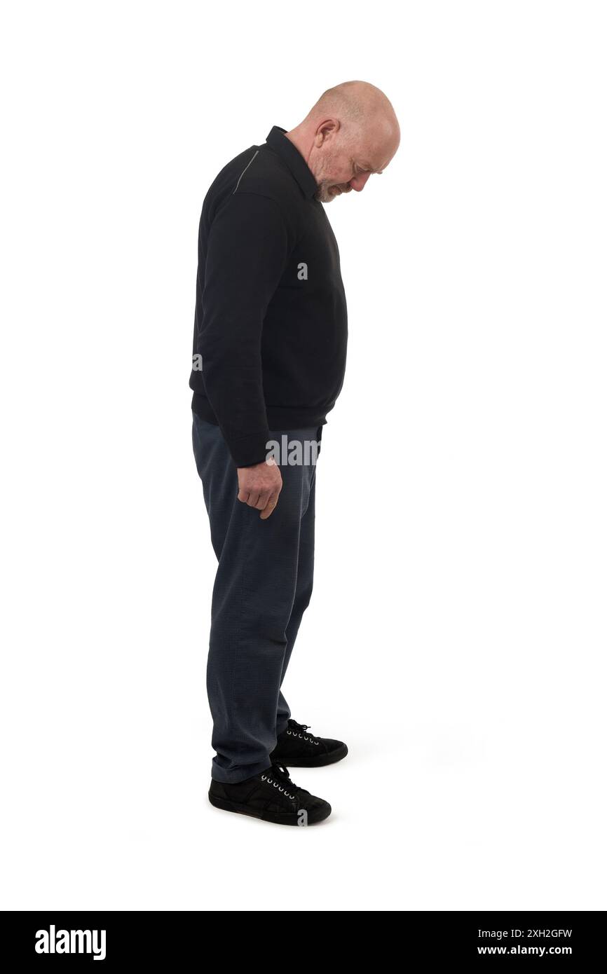side view of a man looking down on white background Stock Photo - Alamy