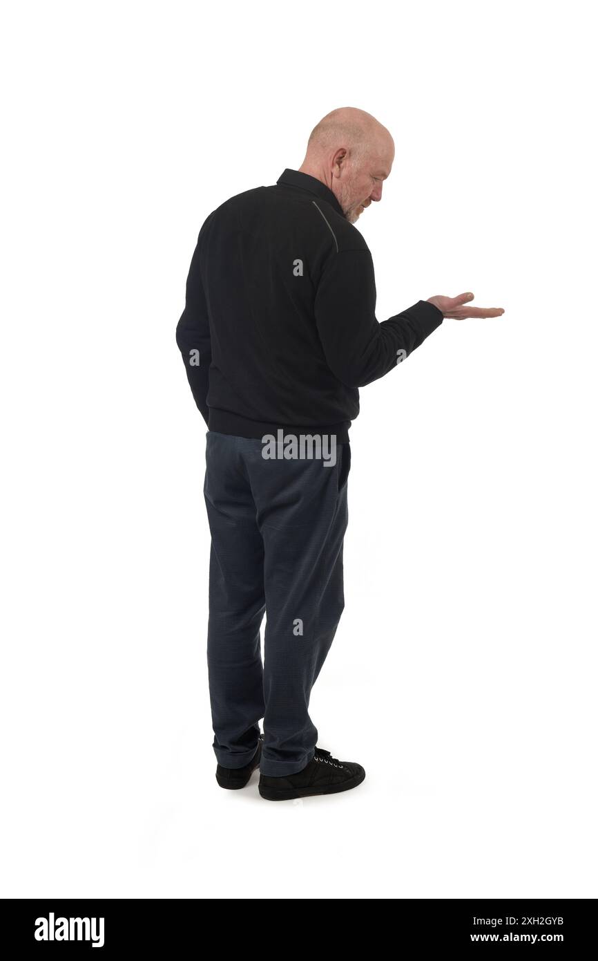 back and side view of a man showing an imaginary object in her hand on ...