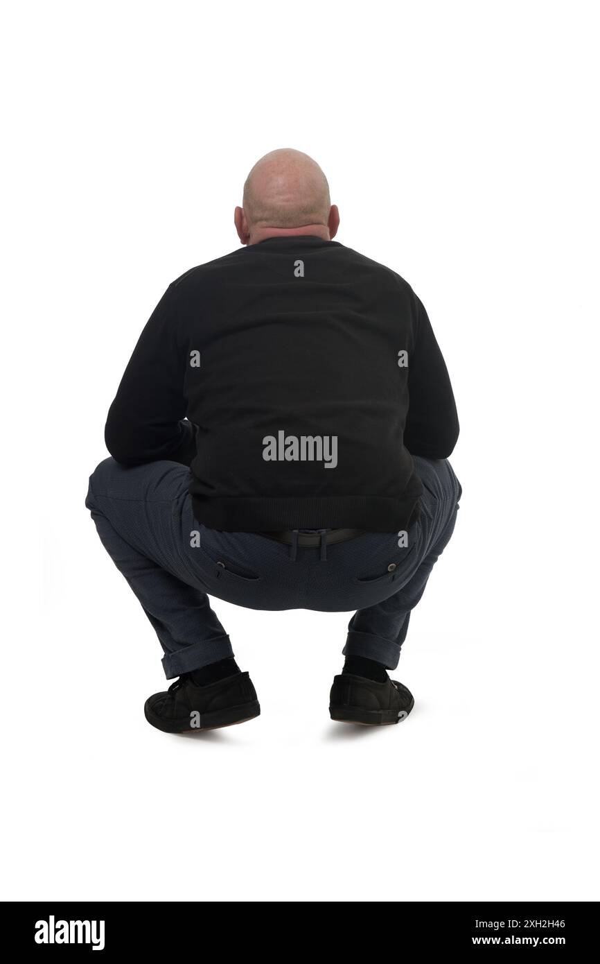 Squatting man Cut Out Stock Images & Pictures - Alamy