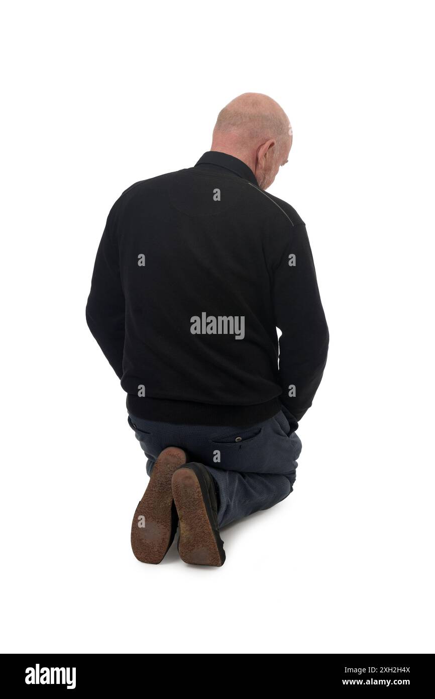 Man kneeling, rear Cut Out Stock Images & Pictures - Alamy