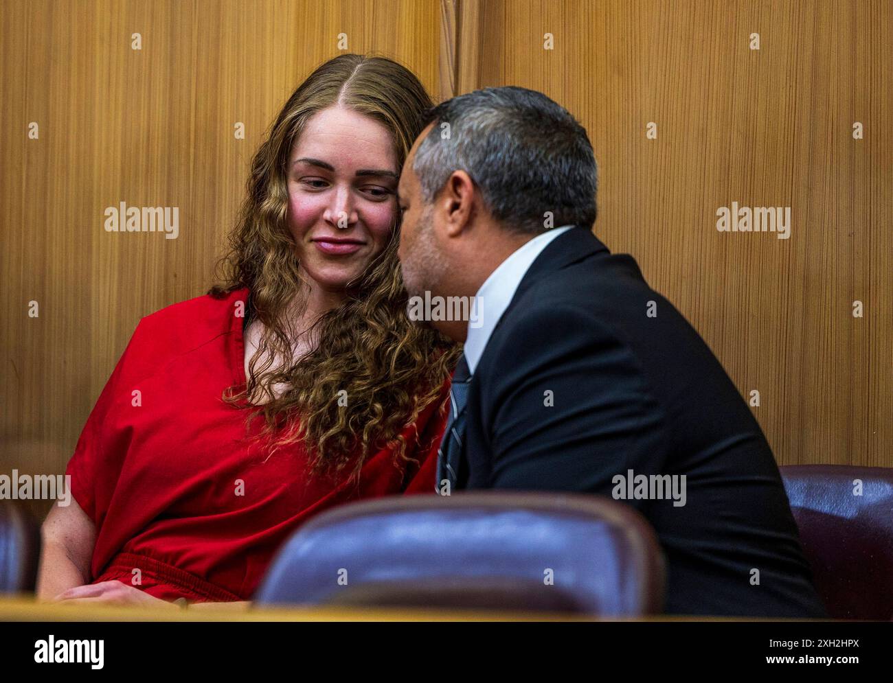 Defense attorney Frank Prieto talks with OnlyFans model Courtney Clenney in the courtroom during ...