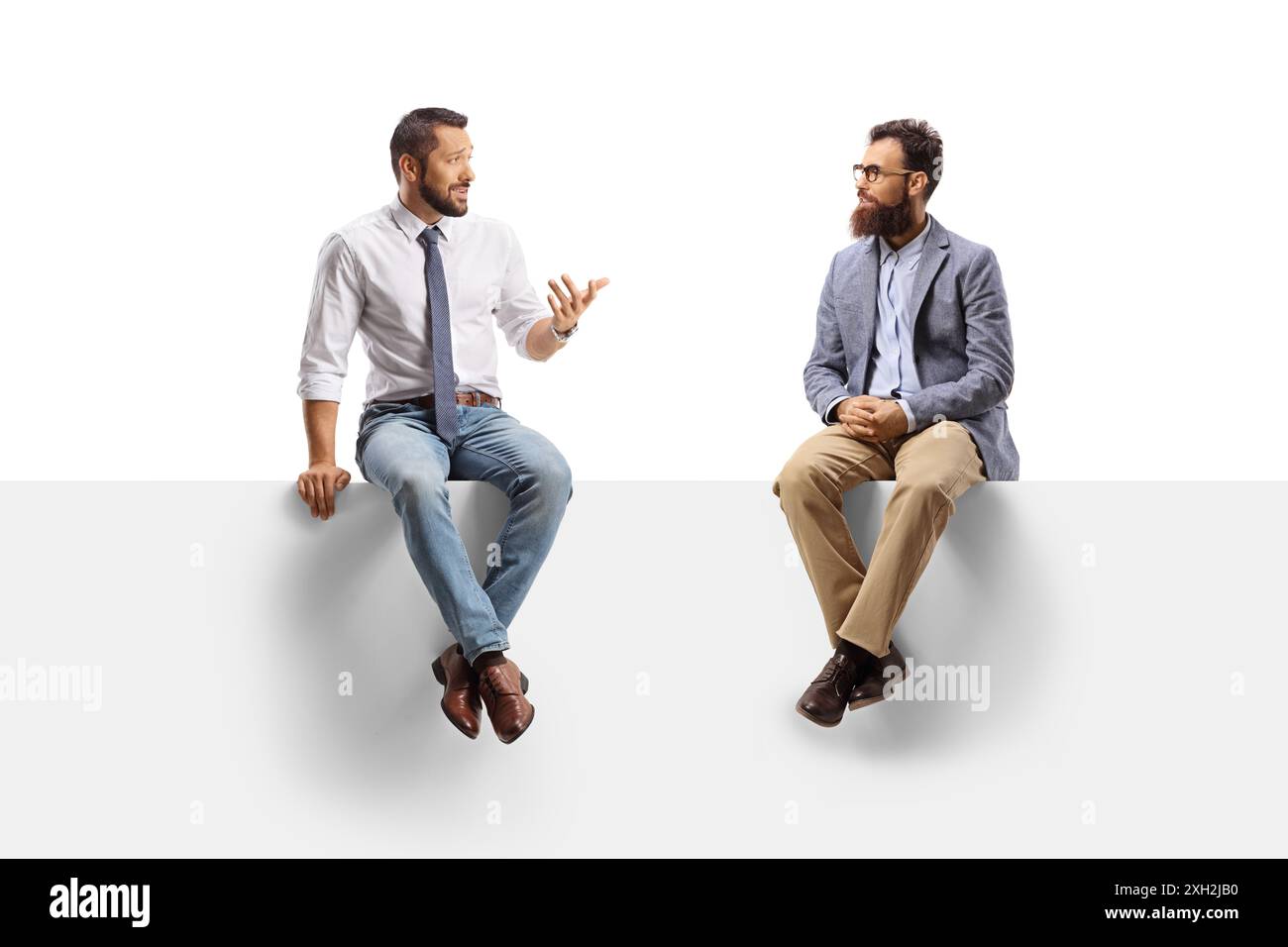 Two professional men sitting on a panel and talking isolated on white ...