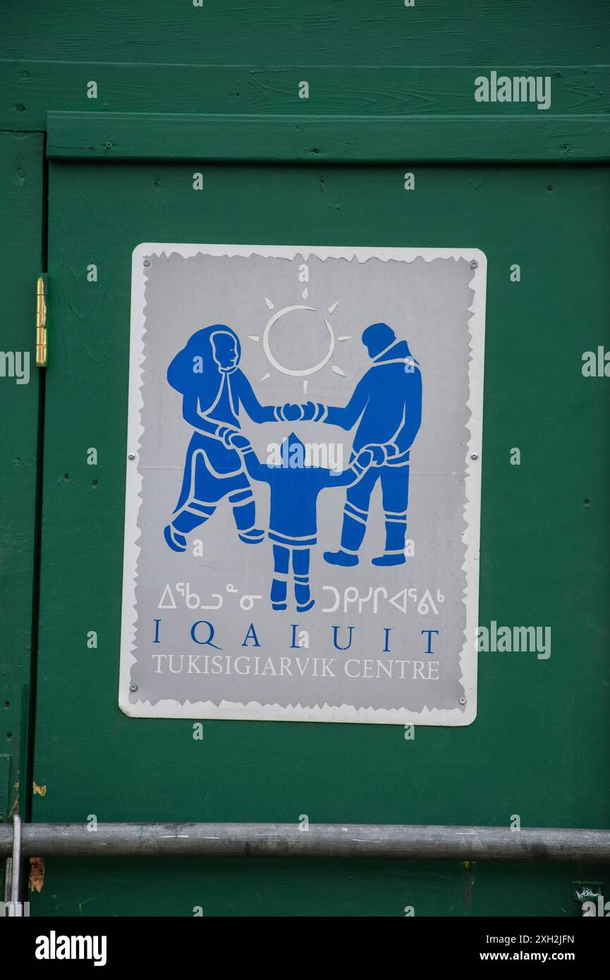 Bilingual Iqaluit Tukisigiarvik Centre sign in English and Inuktitut on ...