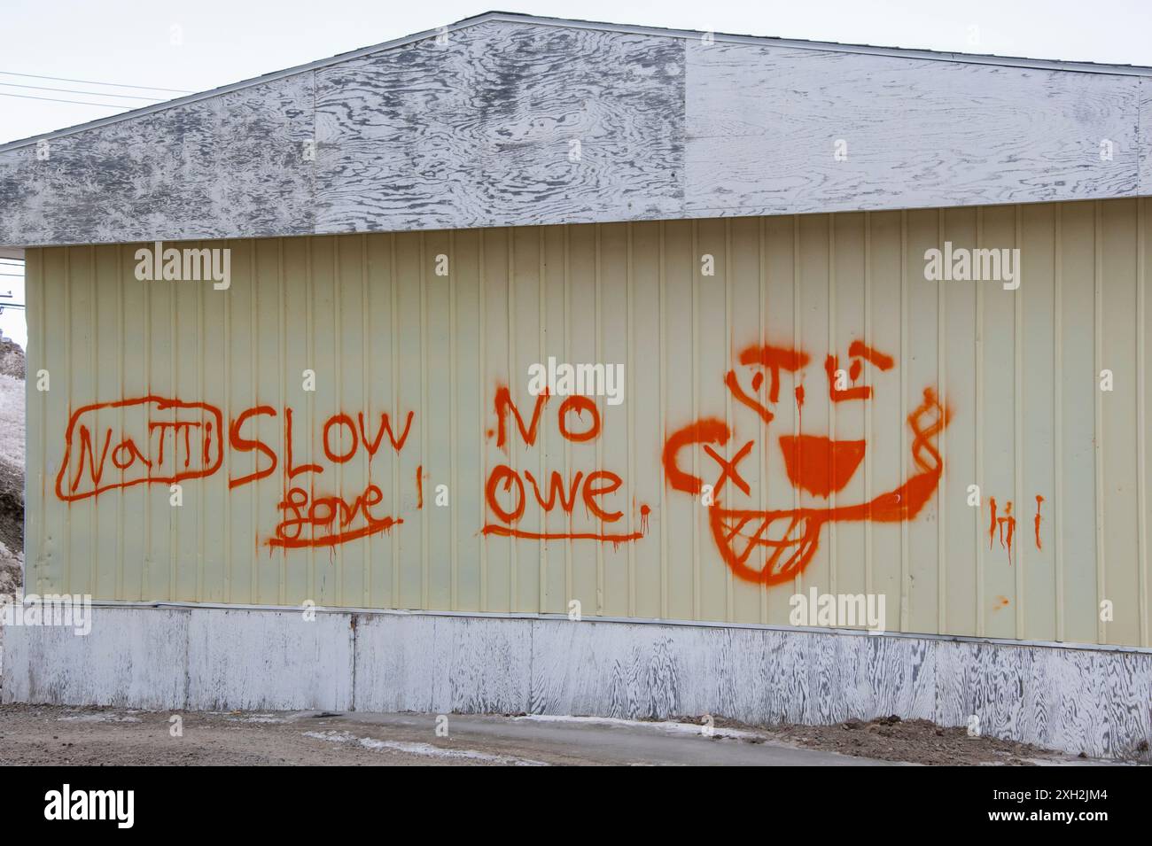 Graffiti tagged on an dilapidated abandoned house in Iqaluit, Nunavut ...