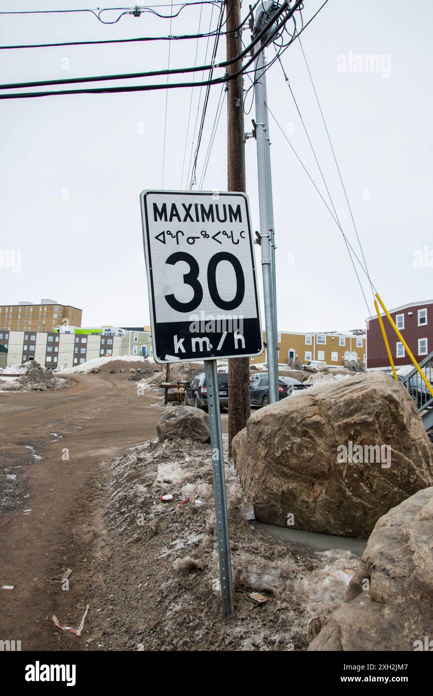 Bilingual speed limit traffic sign in English and Inuktitut in Iqaluit ...