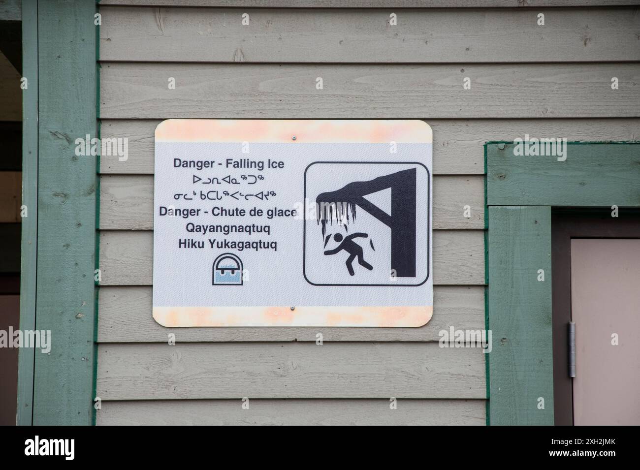 Multilingual danger falling ice sign in English, French, Inuktitut and ...