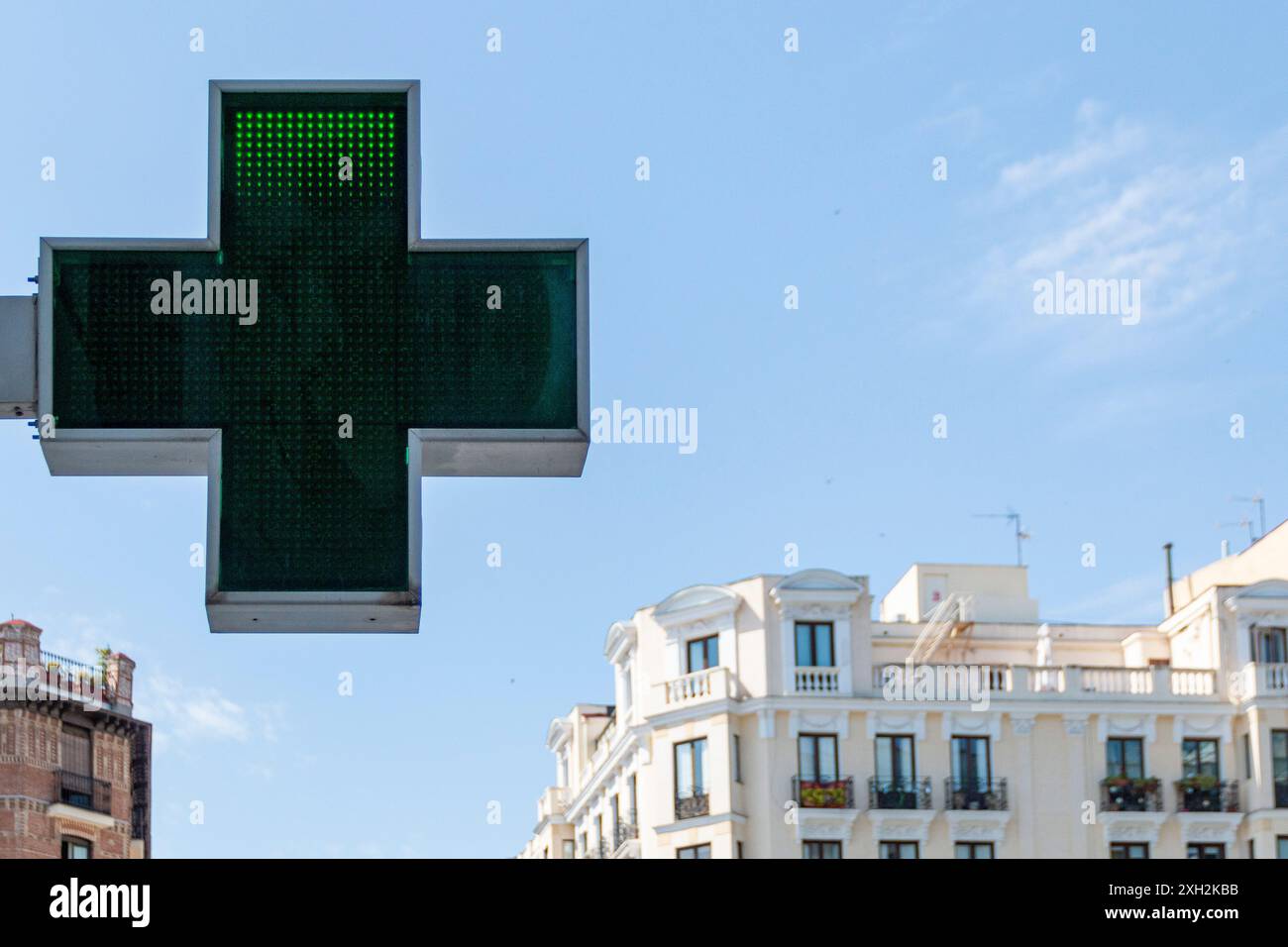 Pharmacy indication sign, a luminous green cross that indicates that a ...
