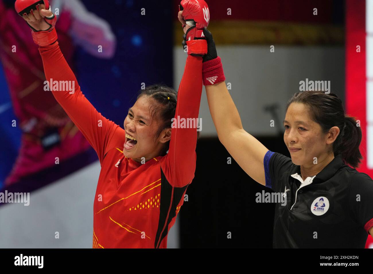 Maricel De La Torre, left, of Philippines, celebrates defeating ...