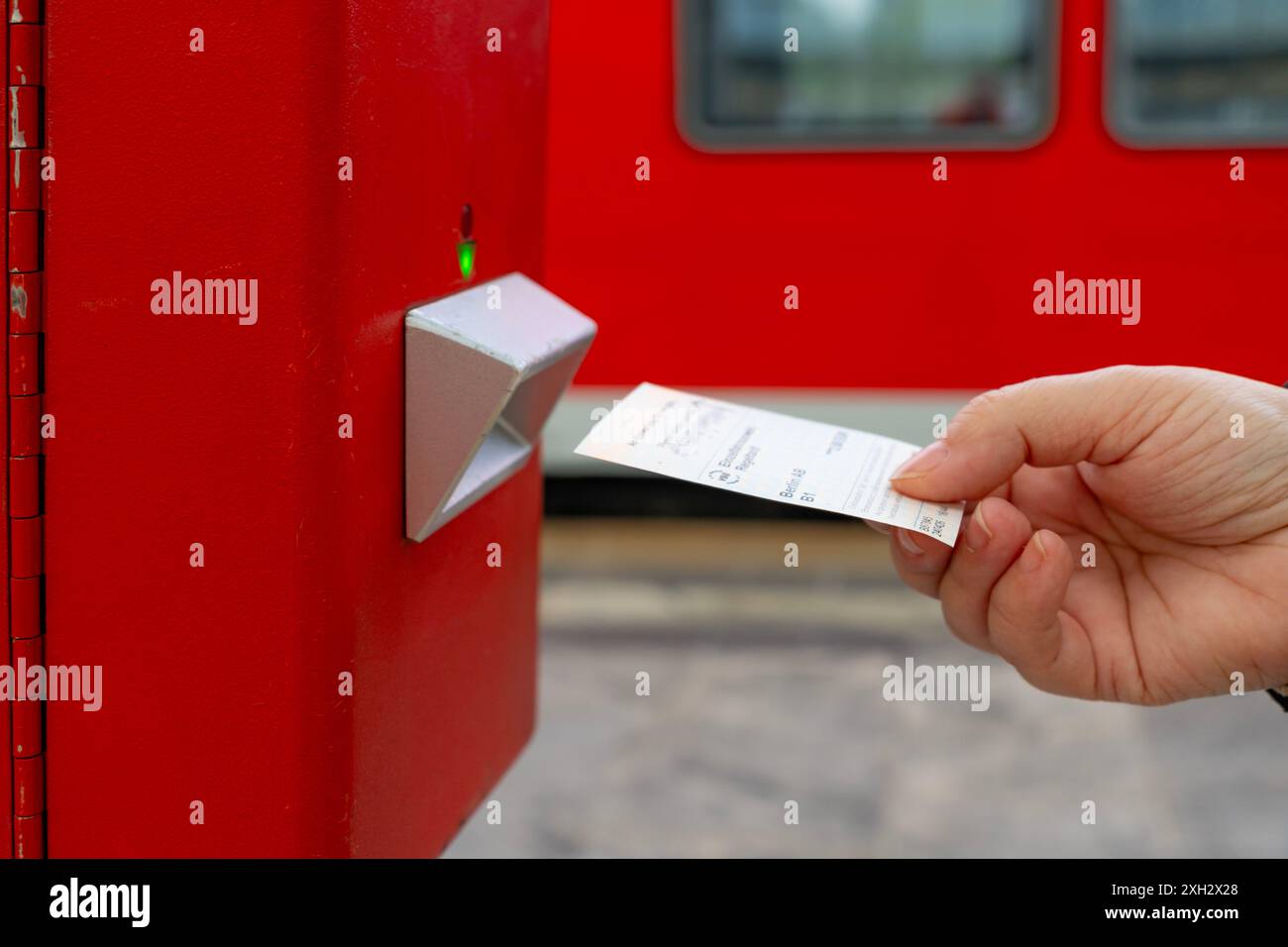 traveler validating train ticket at terminal, public transportation ...