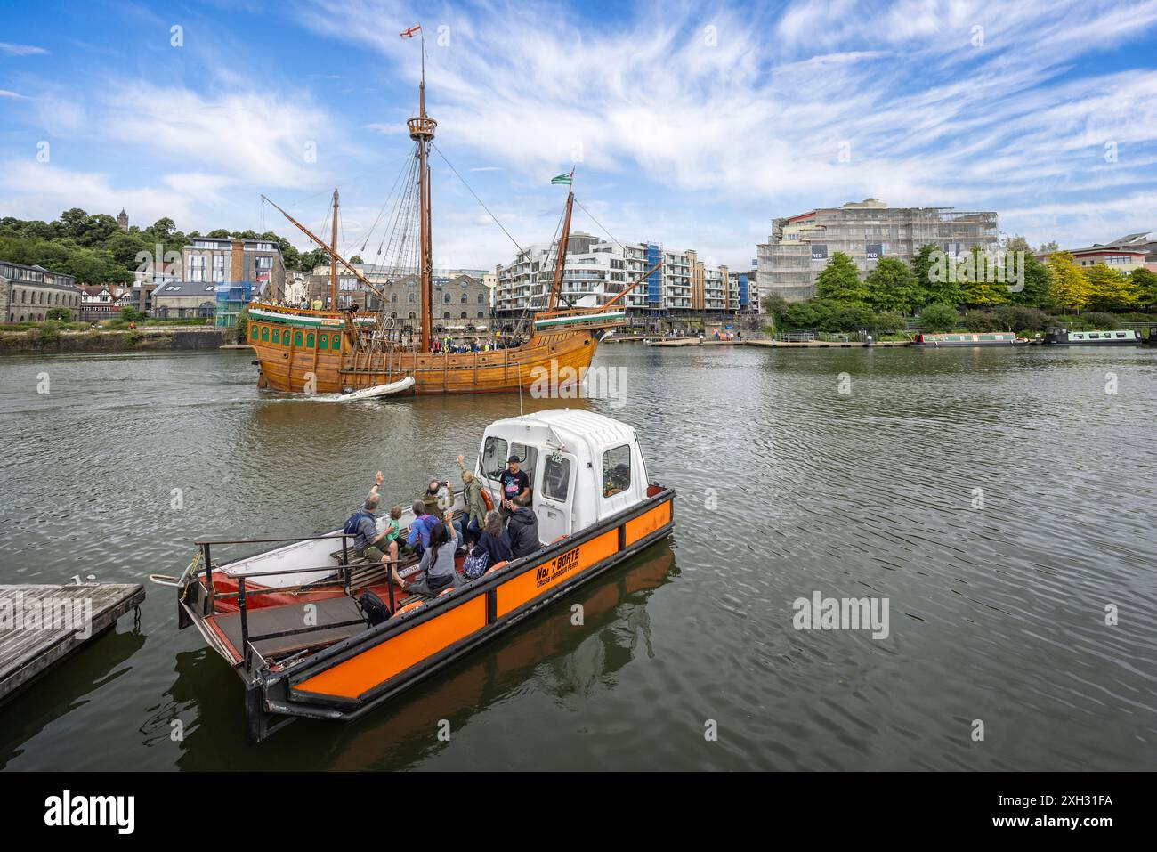 Bristol cross harbour ferry leaving jetty with 15th century Tall Ship ...