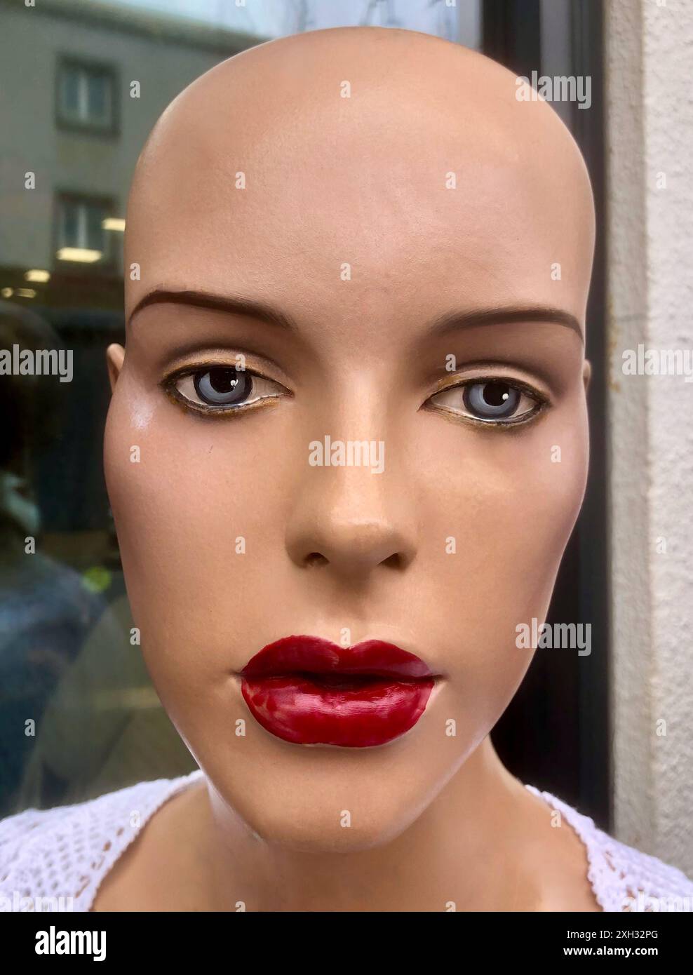 A manikin on the pavement, outside a ladies boutique Stock Photo - Alamy