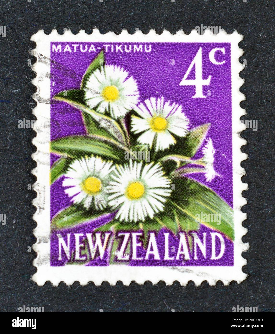 Cancelled postage stamp printed by New Zealand, that shows Mountain ...
