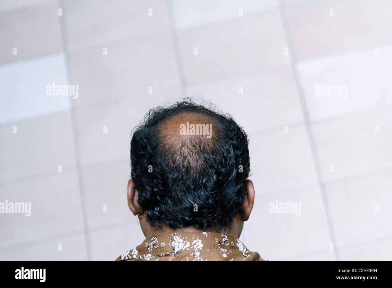 11 October 2019, Singapore, South East Asia: Middle age man, bald back ...