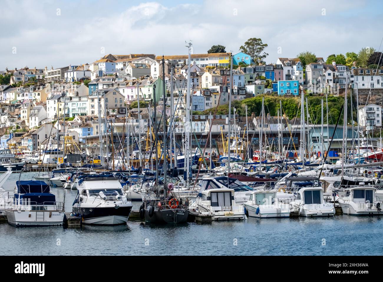 Long range zoom in shot across Brixham Harbour Stock Photo - Alamy
