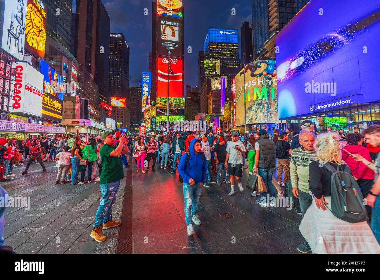 Beautiful night view of Times Square, Manhattan, with people strolling ...
