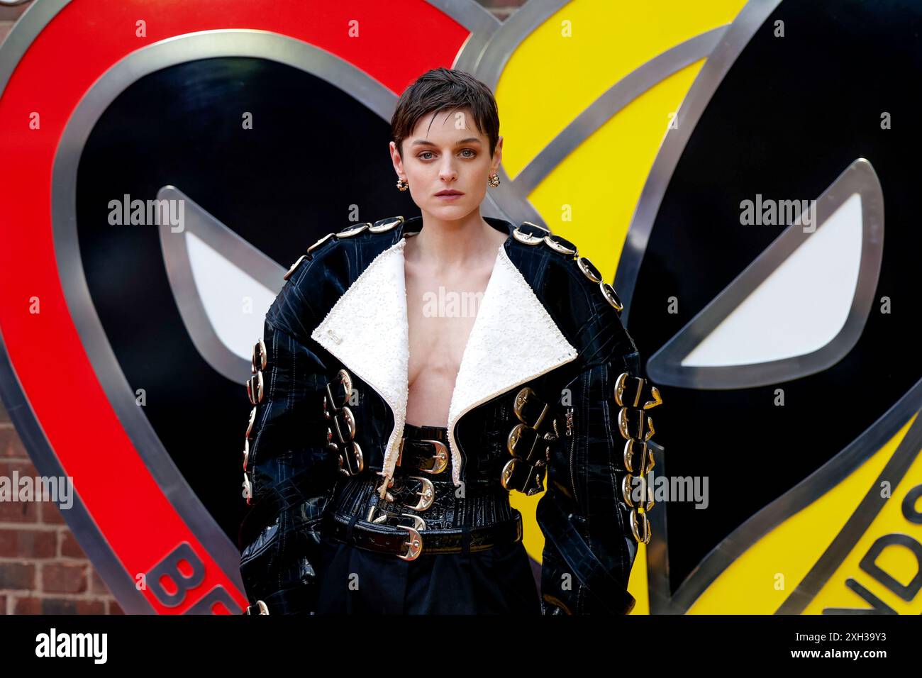 Emma Corrin poses for photographers upon arrival at the screening of ...