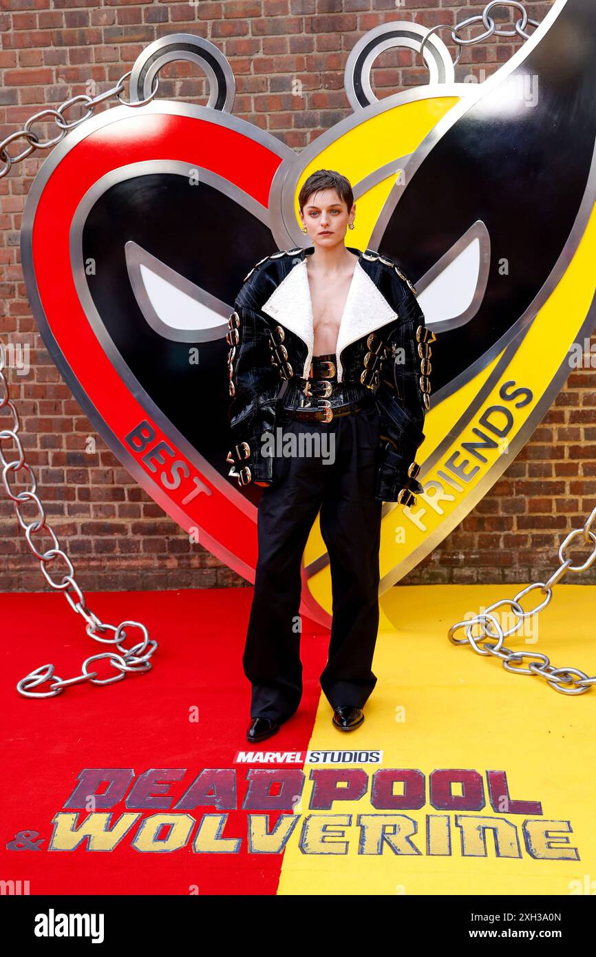 Emma Corrin poses for photographers upon arrival at the screening of ...