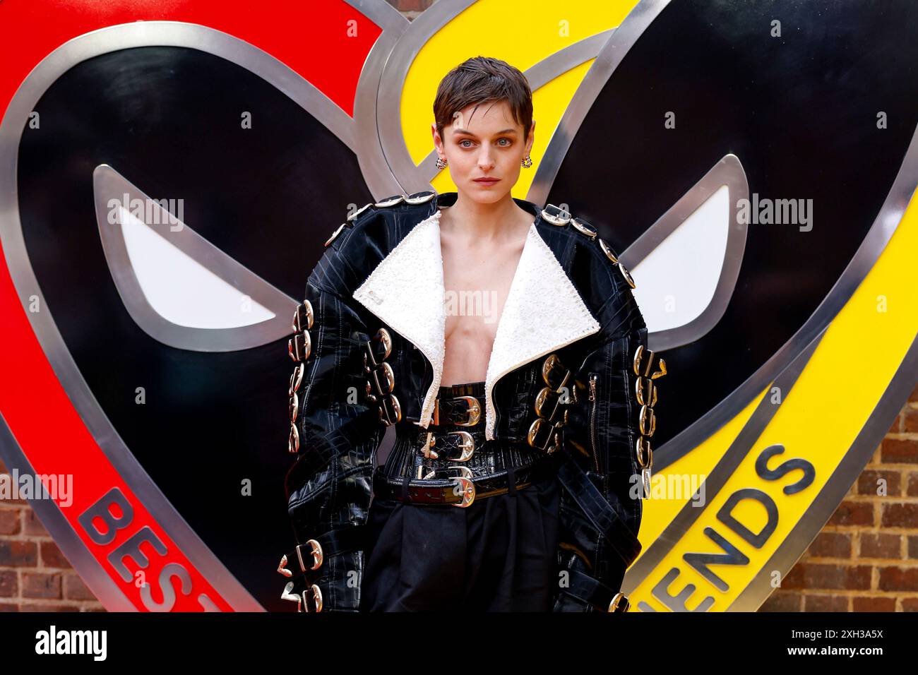 Emma Corrin poses for photographers upon arrival at the screening of ...