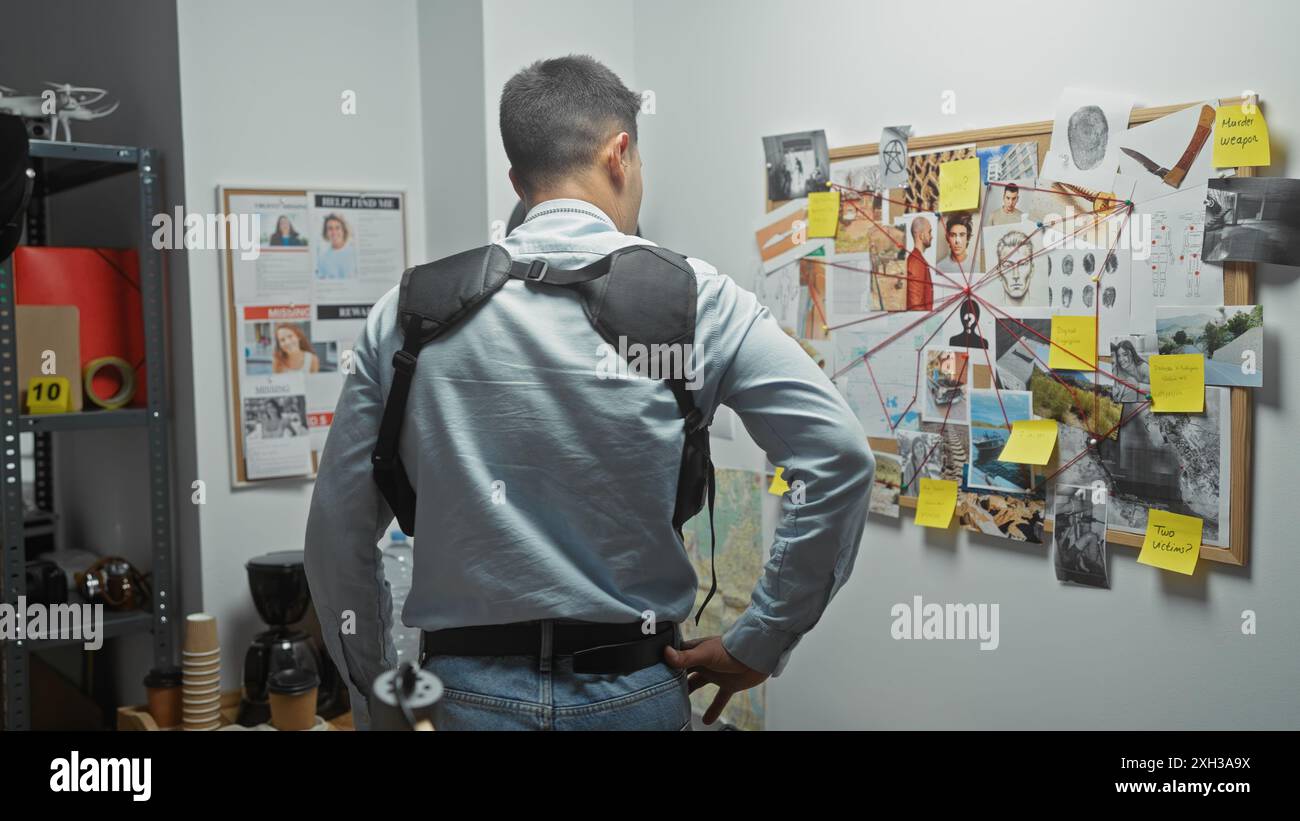 A young hispanic man stands inside a police station contemplating a ...