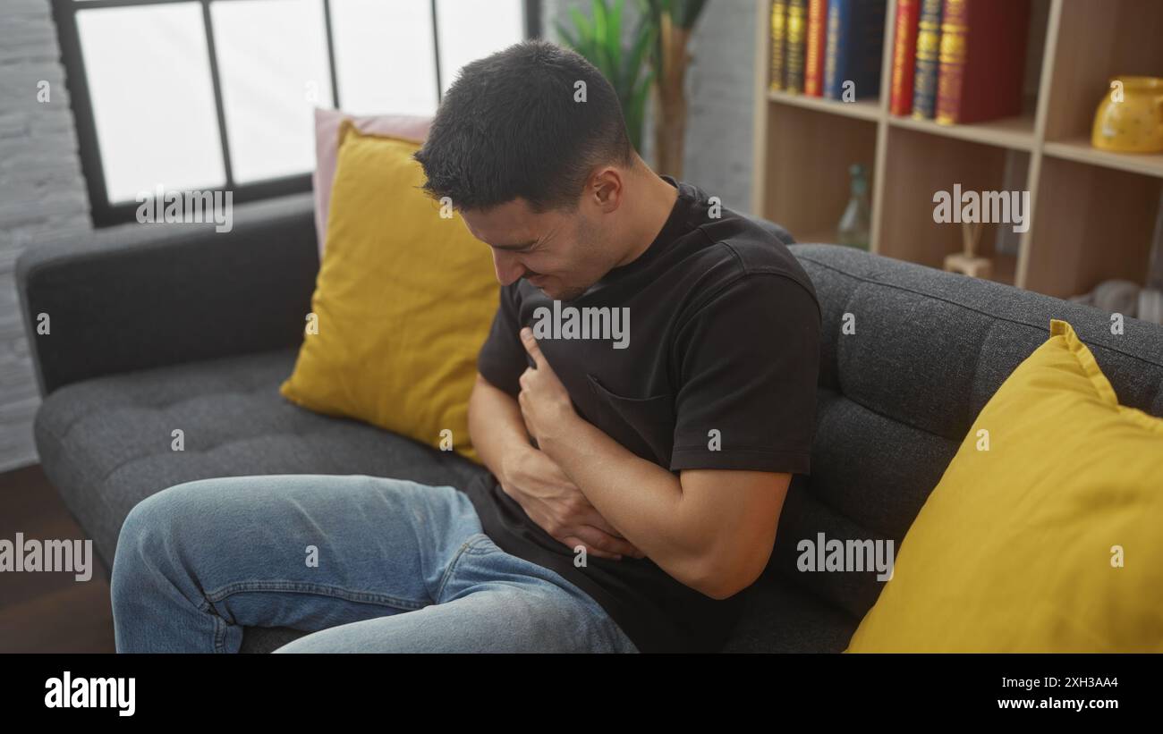 Hispanic man clutching chest pain hi-res stock photography and images ...