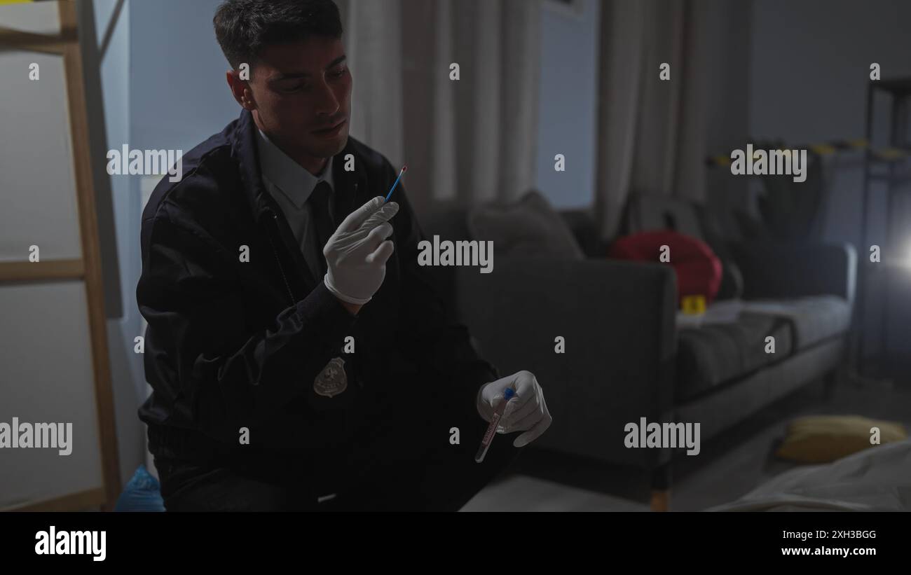 Hispanic detective in uniform examines evidence indoors at a night-time ...