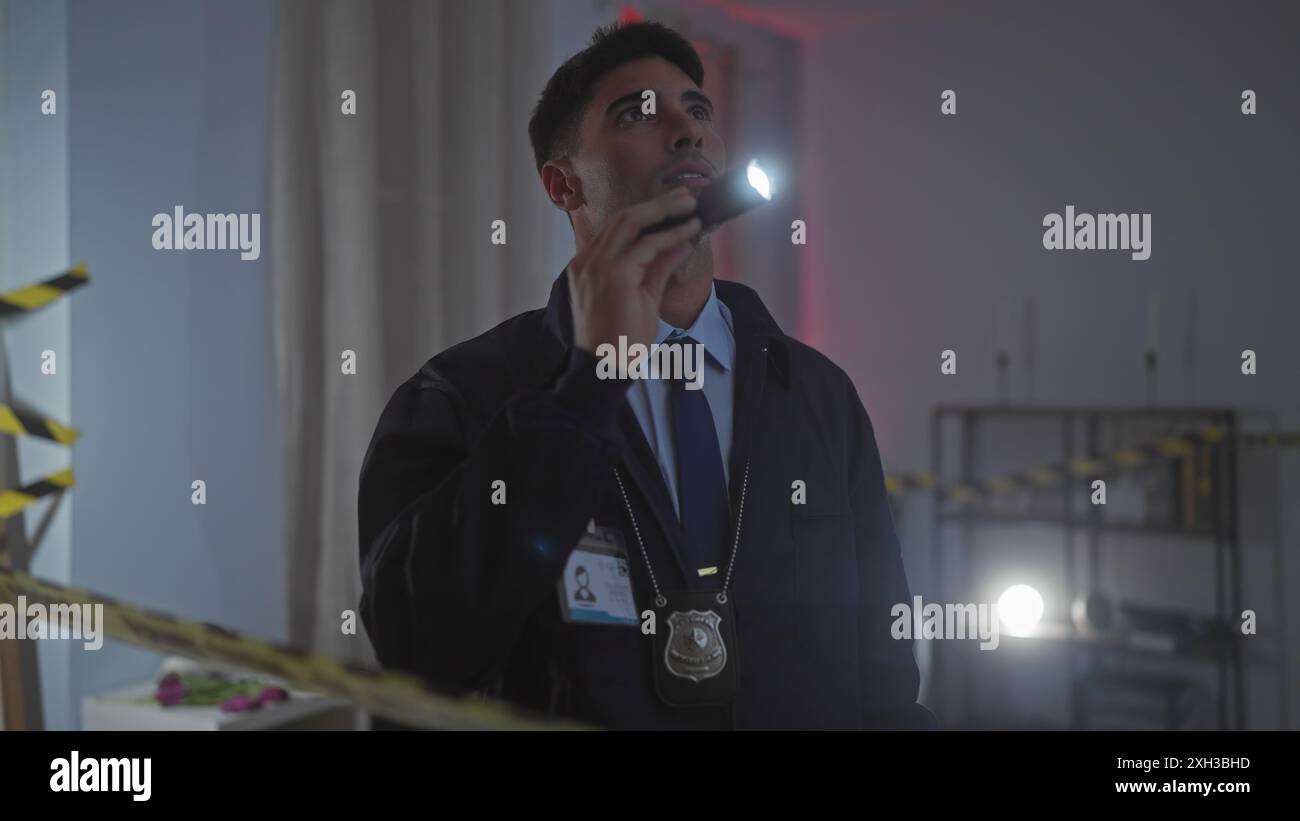Hispanic detective man indoors crime scene investigation flashlight ...