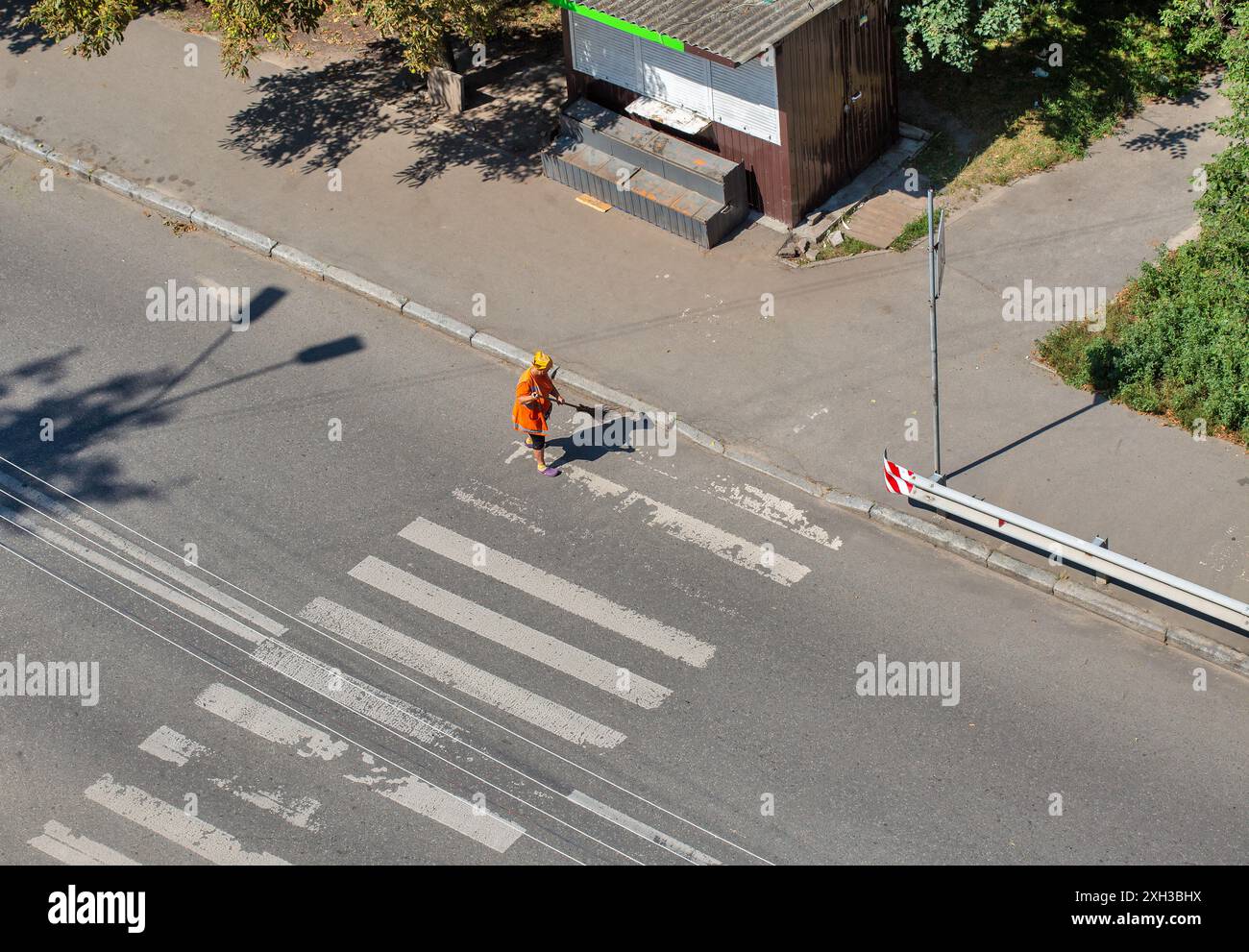 Woman street cleaner sweeping hi-res stock photography and images - Alamy