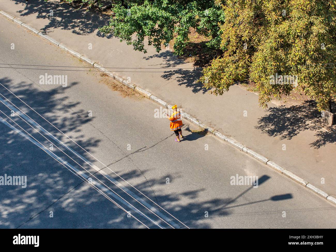 Woman street cleaner sweeping hi-res stock photography and images - Alamy