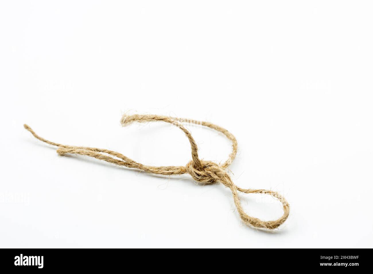 Thick felt rope tied in a noose closeup on a white Stock Photo - Alamy