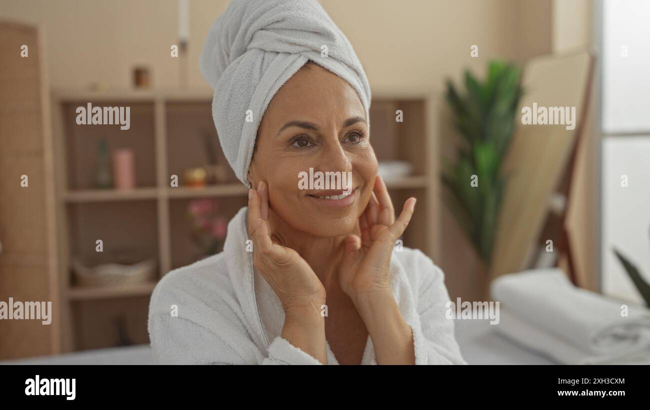 Mature hispanic woman enjoying a relaxing moment in a spa wellness ...