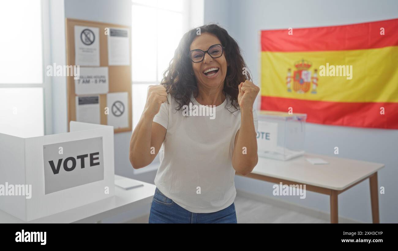 Woman celebrating in voting room with spanish flag in background Stock ...