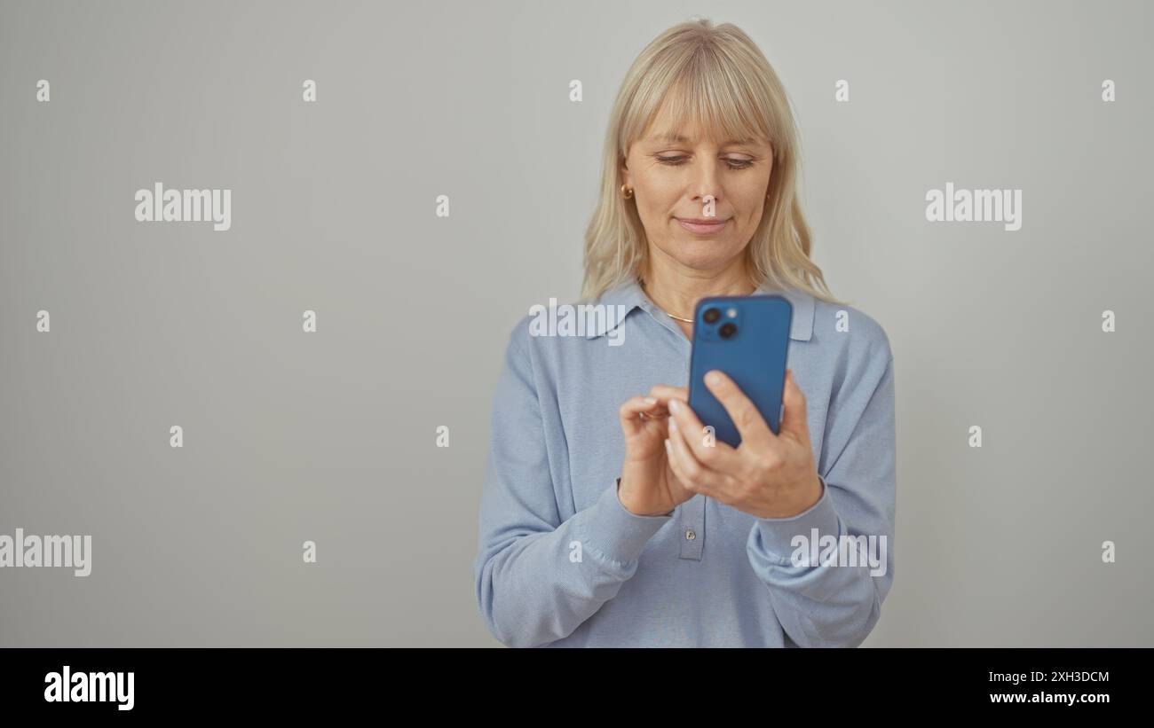 Focused blonde woman uses hi-res stock photography and images - Alamy