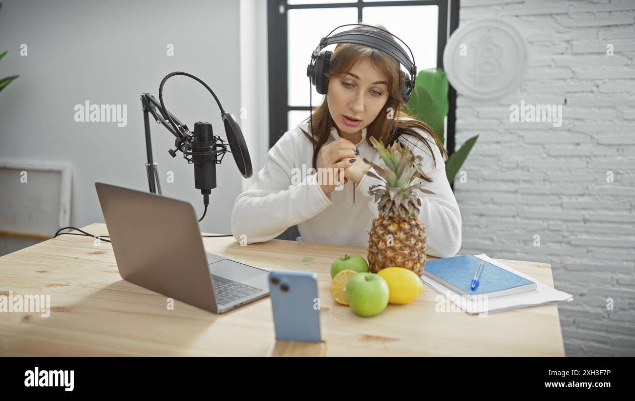Caucasian woman podcasting in a modern studio with microphone and ...