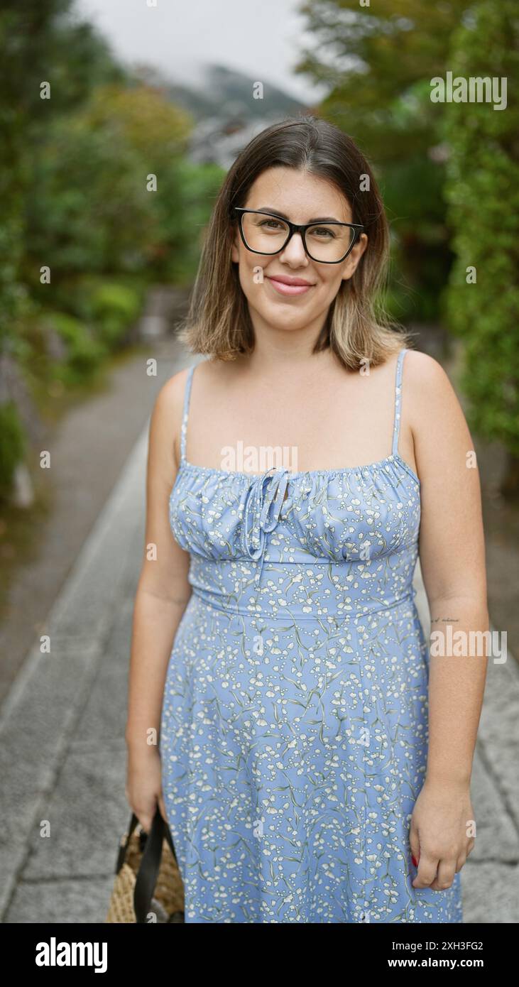 Confident hispanic woman, beautiful and joyful, cheerfully posing with ...