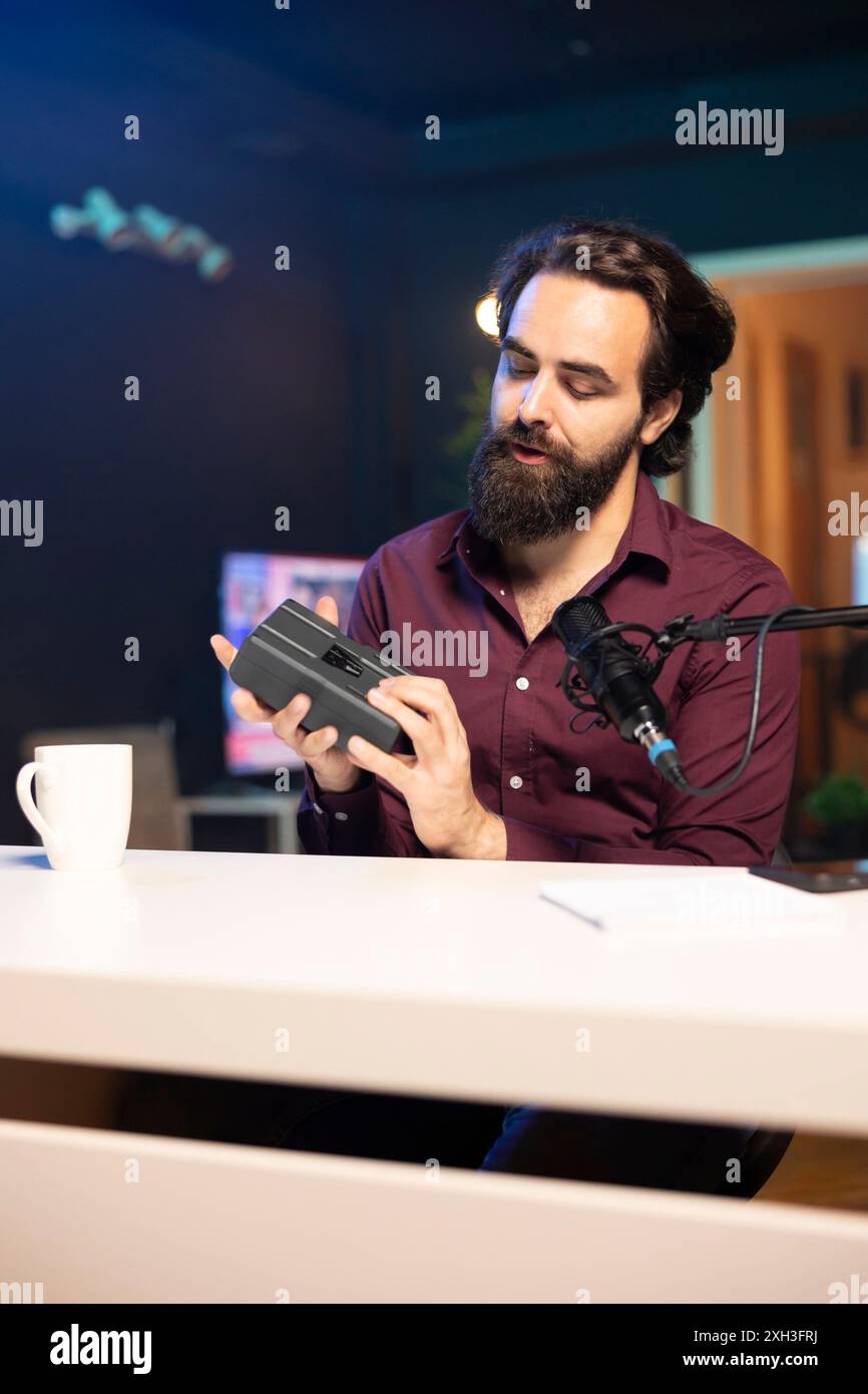 Tech content creator filming technology review of newly released V ...