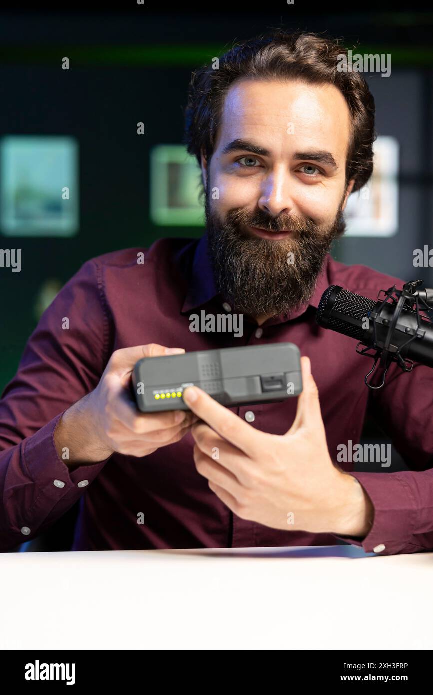 Tech expert filming technology review of newly released V mount battery ...