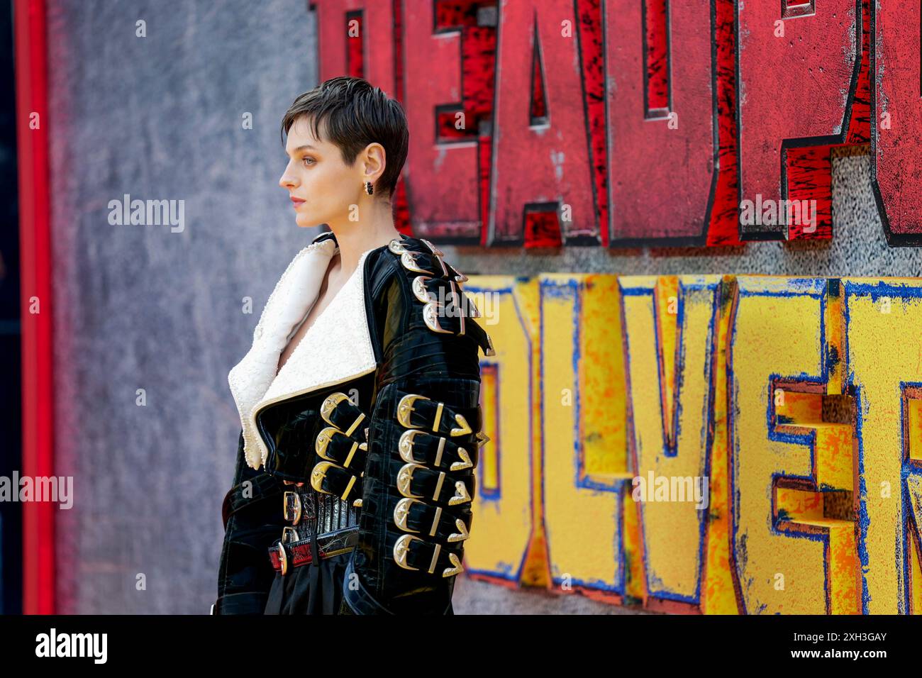Emma Corrin poses for photographers upon arrival at the screening of ...