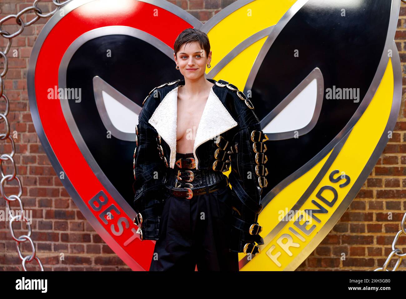 Emma Corrin poses for photographers upon arrival at the screening of ...