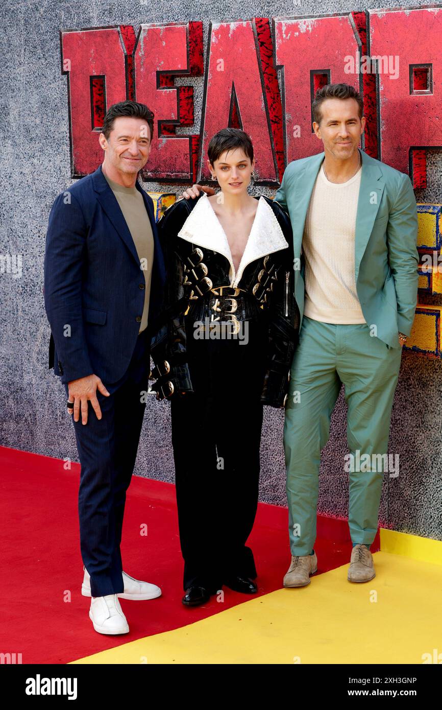 Ryan Reynolds, from left, Hugh Jackman, and Emma Corrin pose for ...