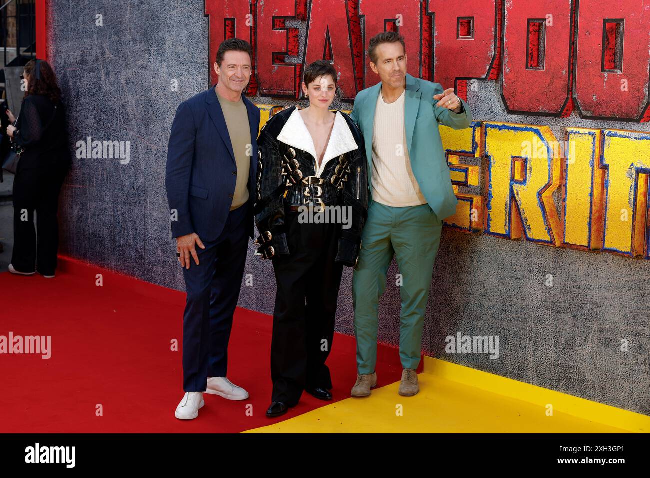 Ryan Reynolds, from left, Hugh Jackman, and Emma Corrin pose for ...